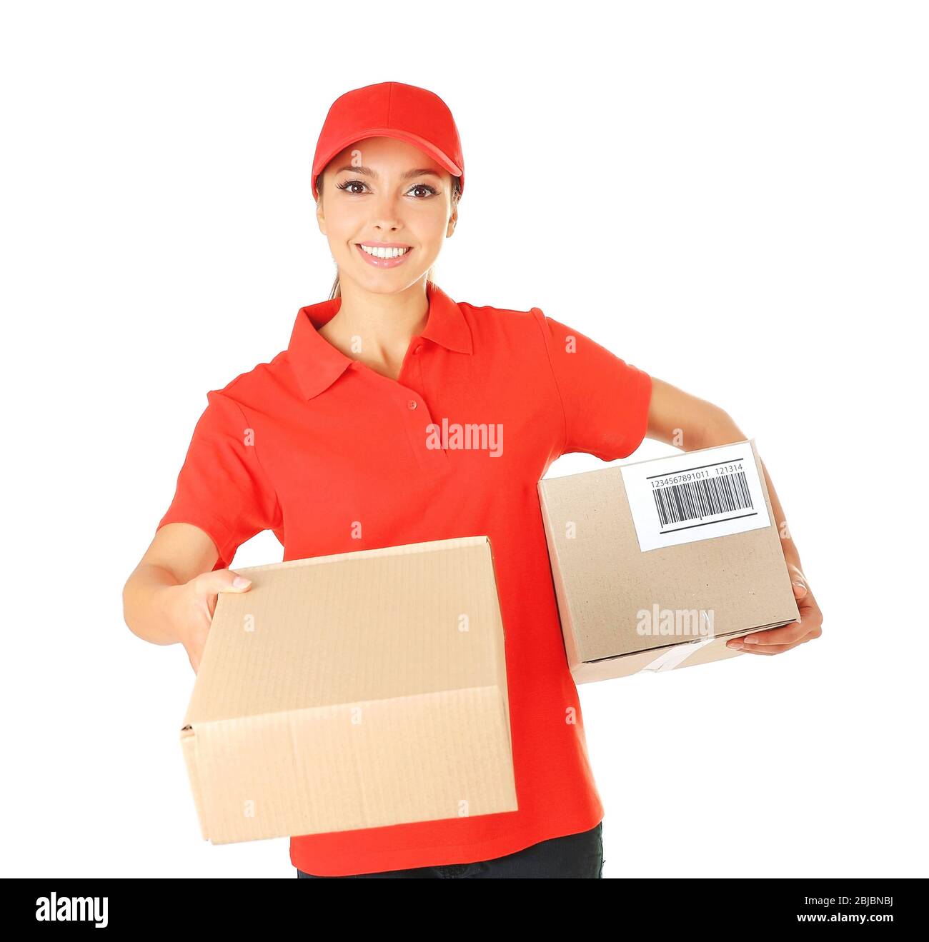 Delivery woman in uniform with parcels on white background Stock Photo ...