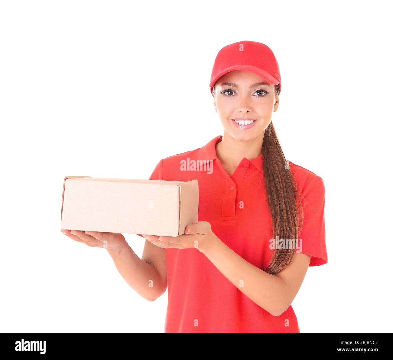 Delivery woman in uniform with parcel on white background Stock Photo ...
