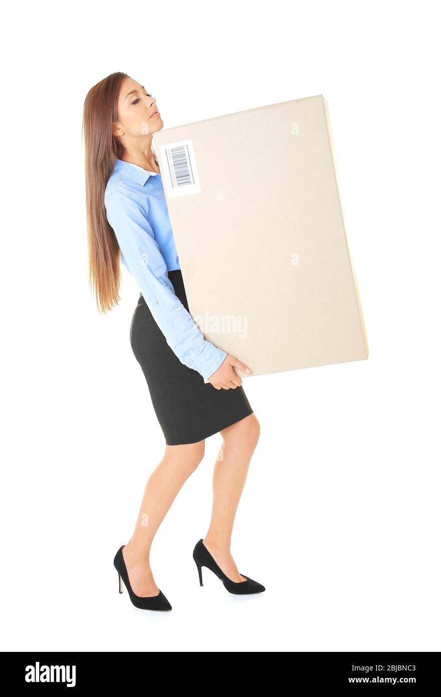 Beautiful businesswoman carrying heavy box on white background Stock ...