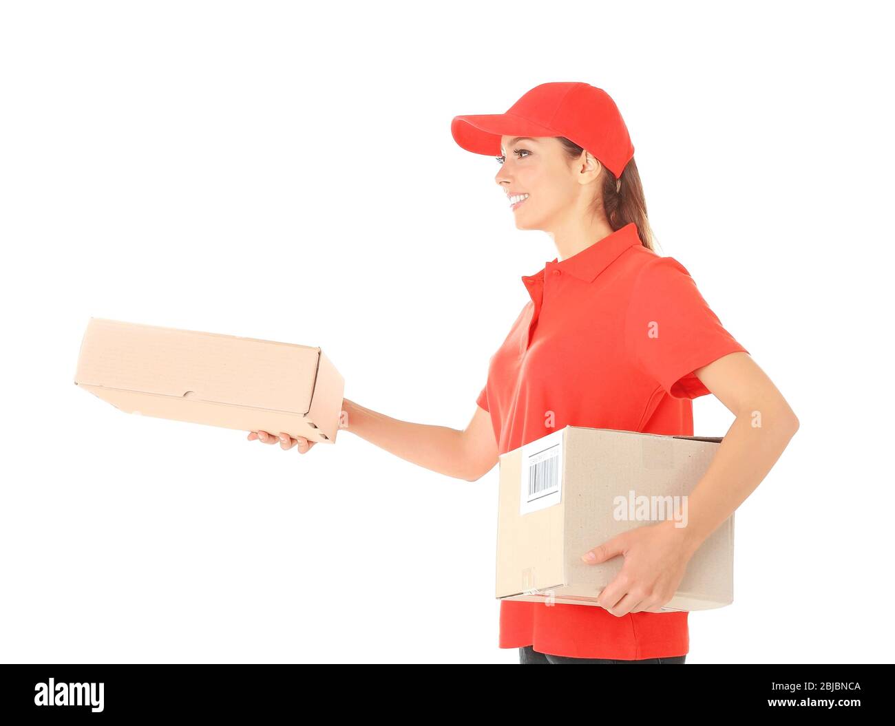 Delivery woman in uniform with parcels on white background Stock Photo ...
