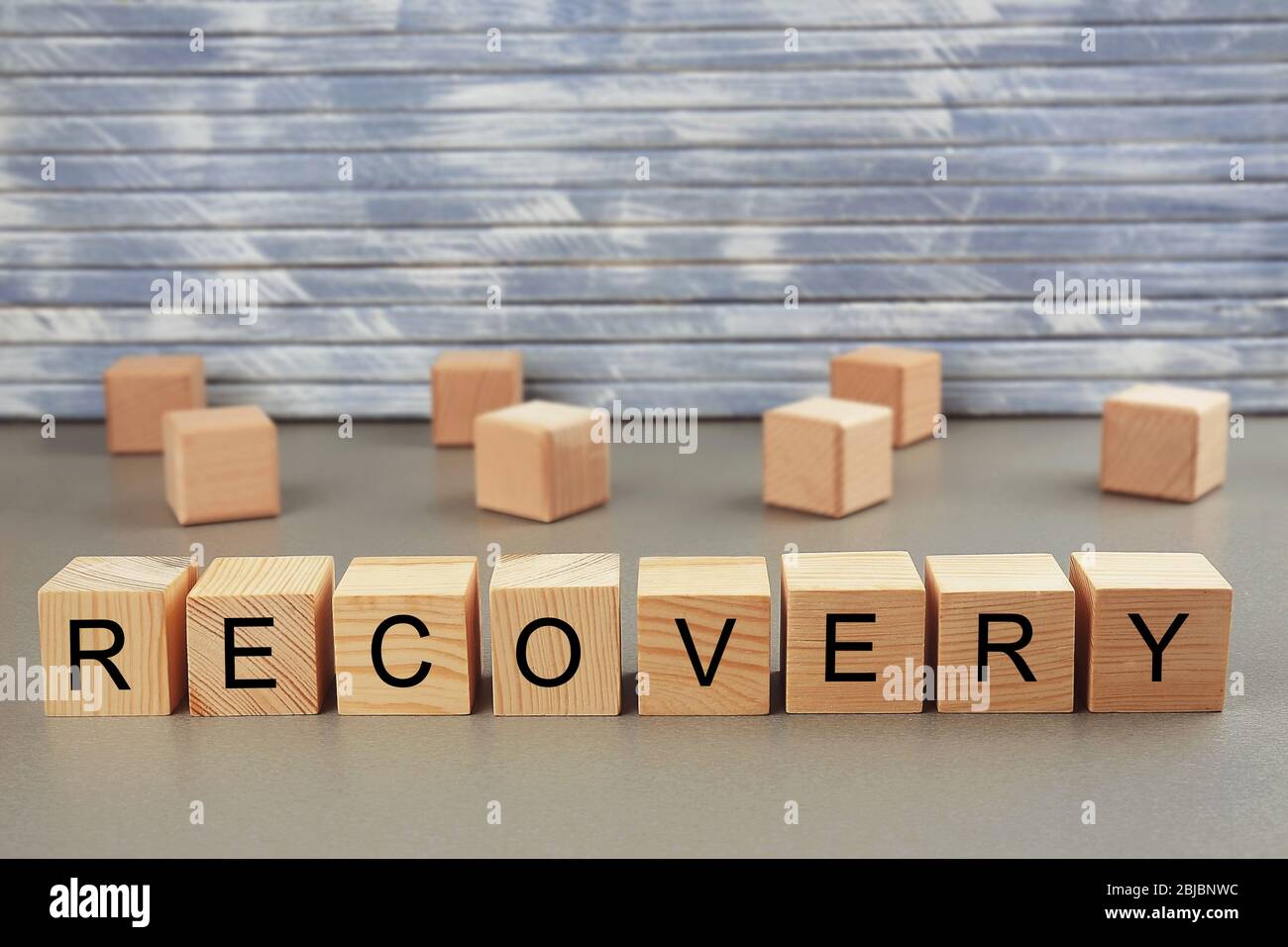 Word recovery written on wooden blocks on wall background Stock Photo ...