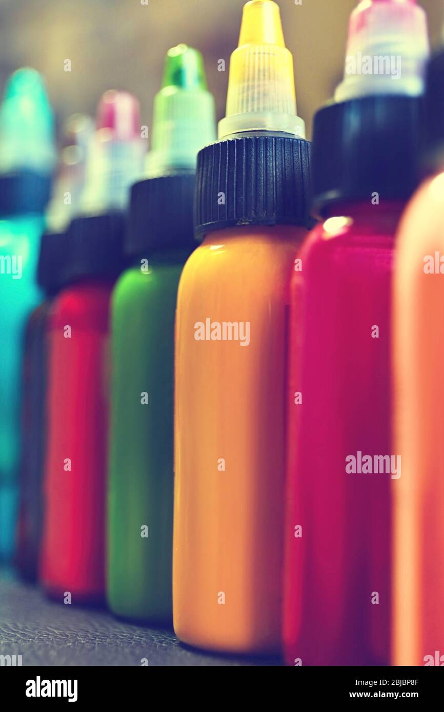 Multiple bottles with colorful inks for tattoo, close up view Stock ...