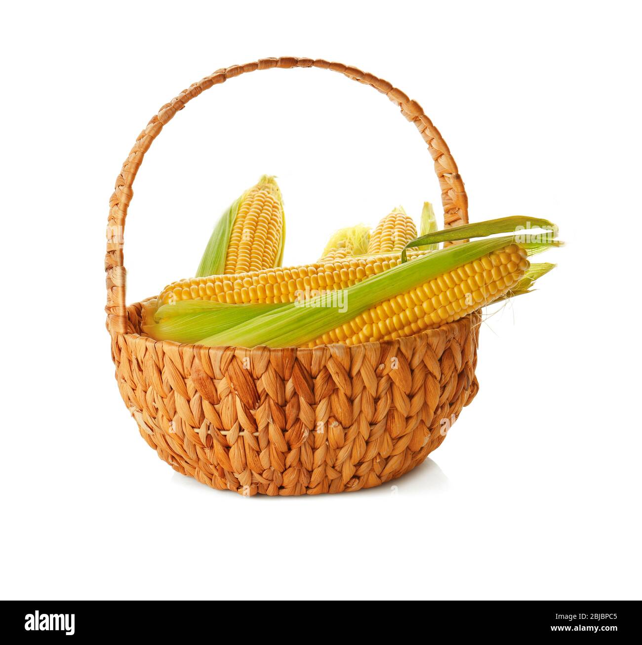 Fresh sweet corn in basket on white background Stock Photo - Alamy