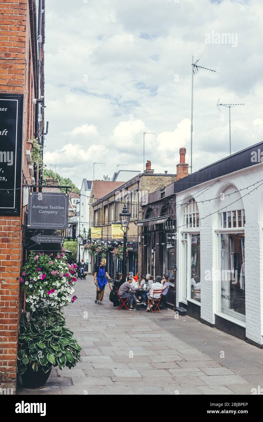 London/UK- 30/07/19: people sitting at the tables just outside the Mani ...
