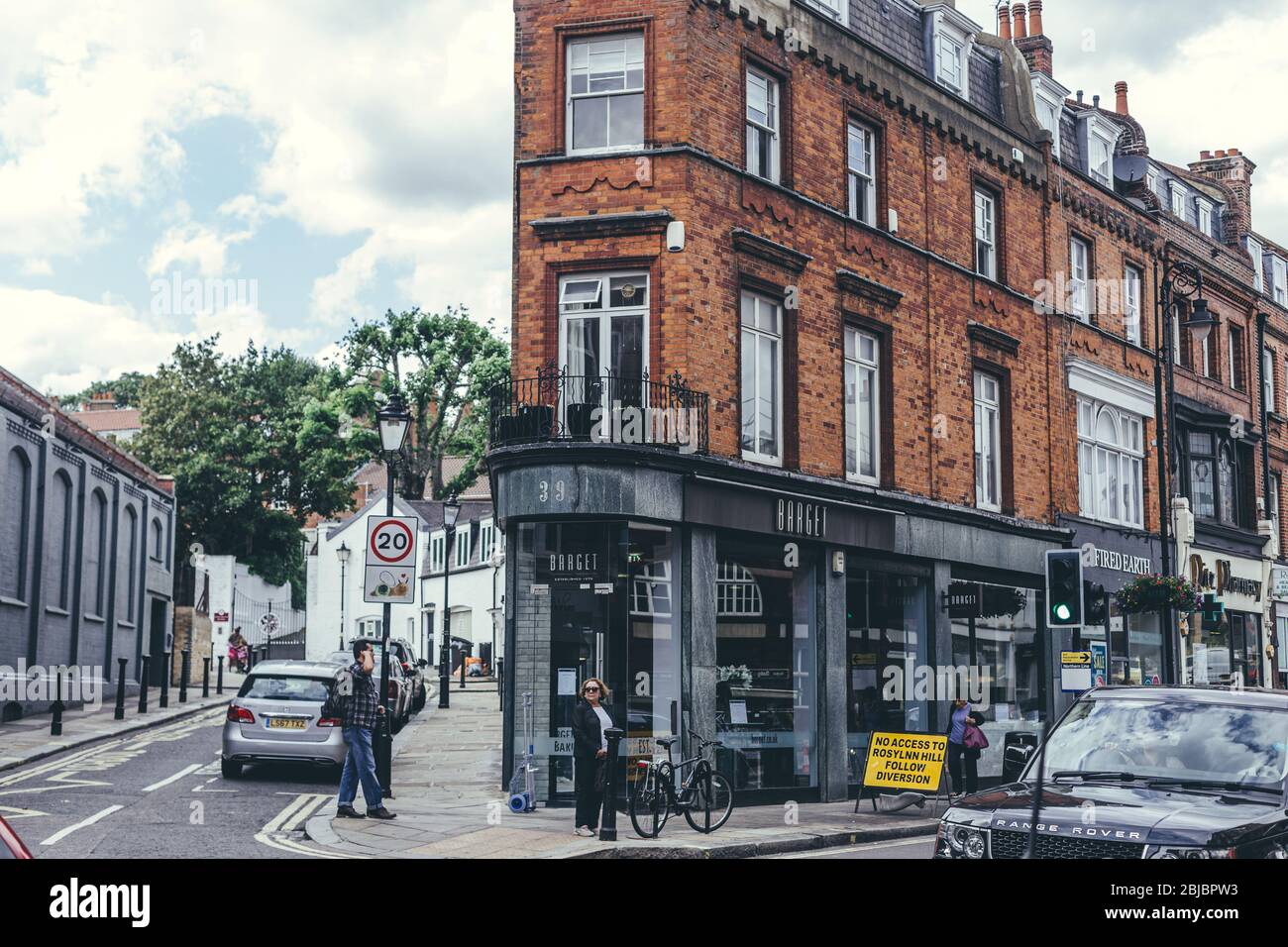 London/UK- 30/07/19: people walking past the Barget Kitchens design ...