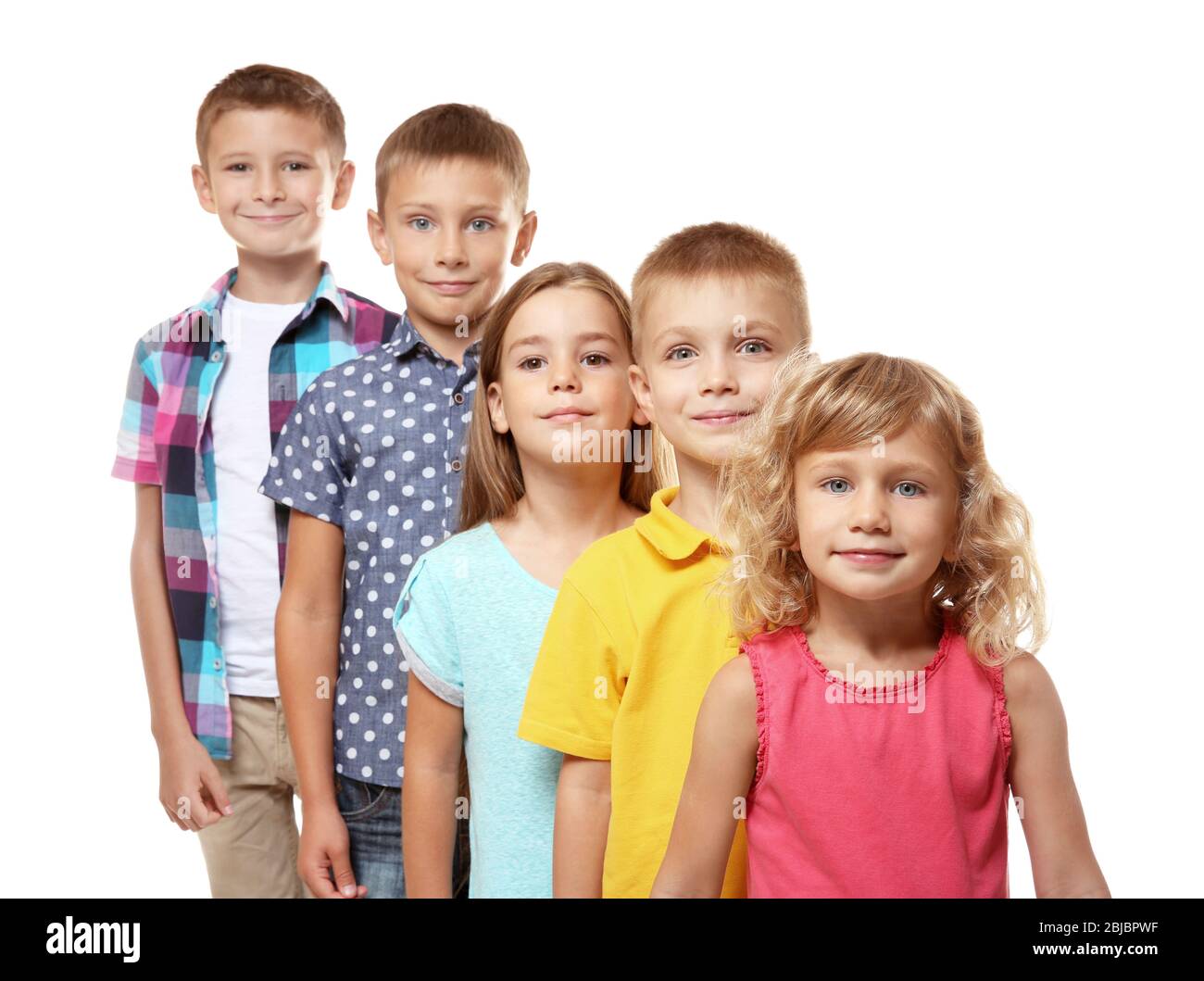 Cute children standing in a row on white background Stock Photo - Alamy