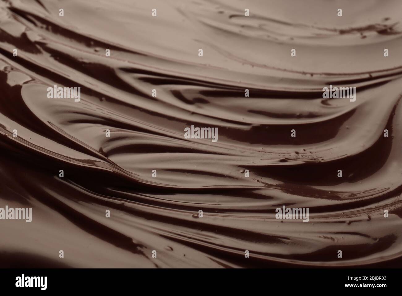 Melted chocolate background Stock Photo - Alamy