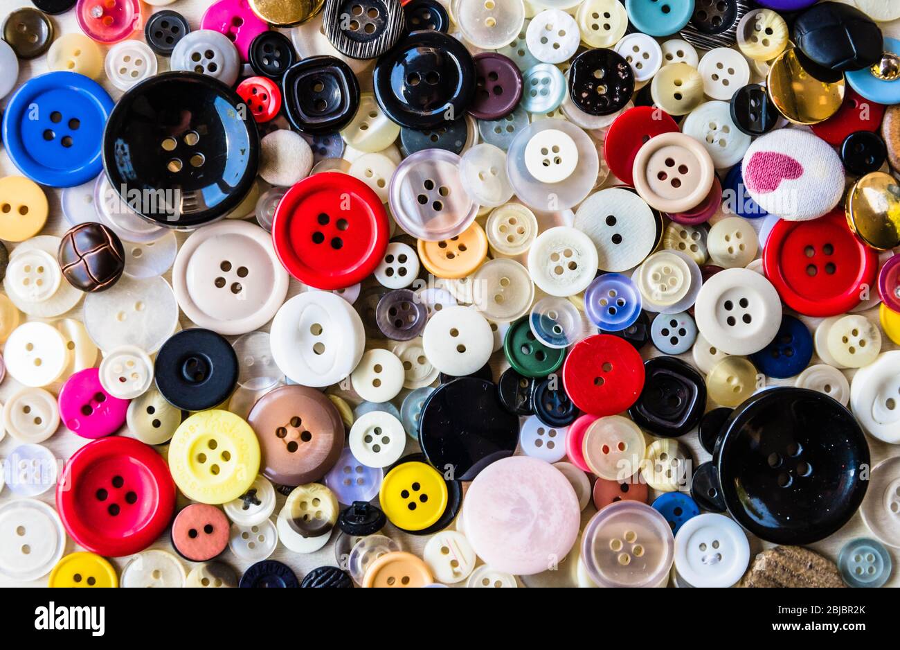 Collection of clothing buttons of various sizes and colors Stock Photo ...