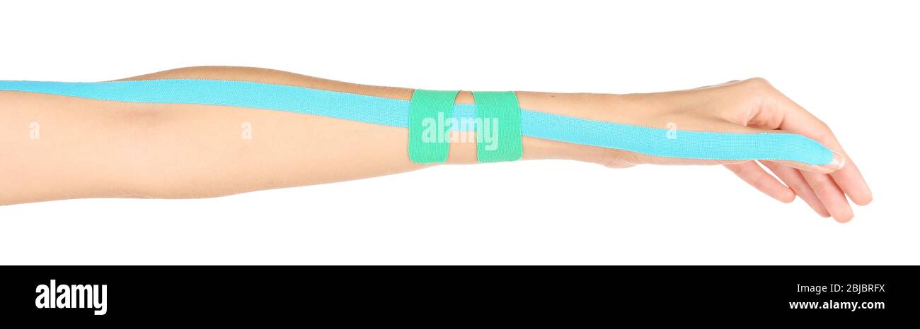 Physiotherapy concept. Female hand with physio tape on white background ...