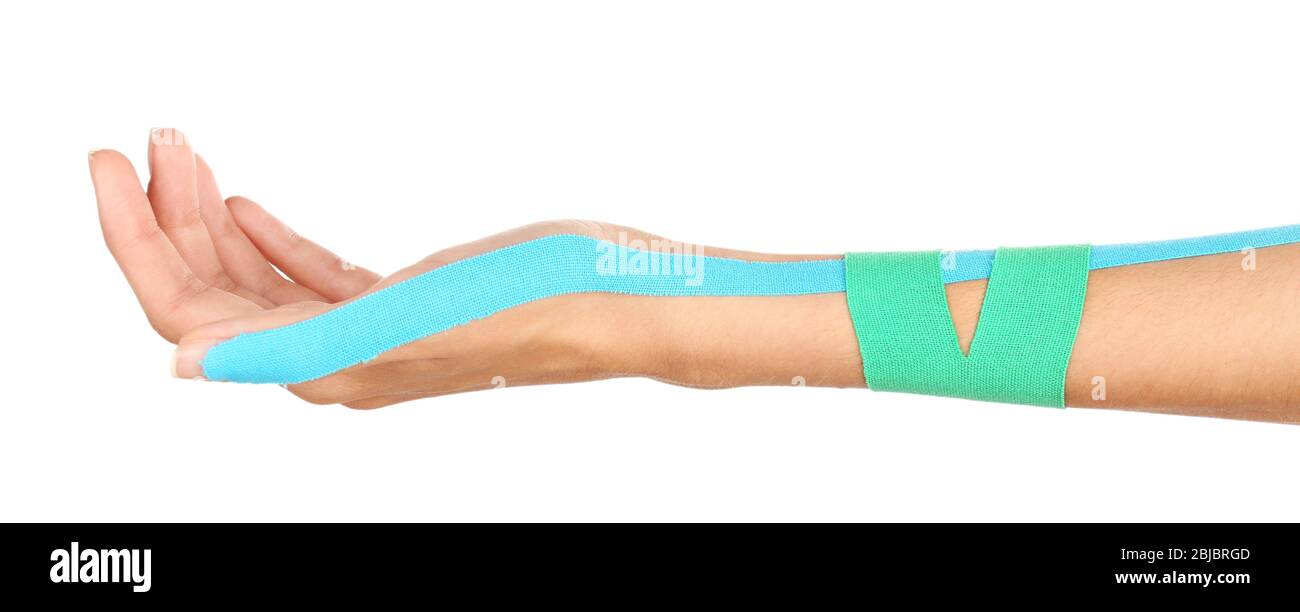 Physiotherapy concept. Female hand with physio tape on white background ...