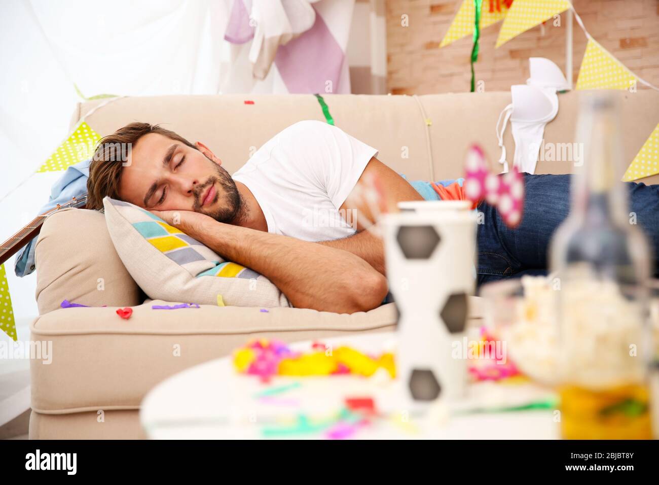 Tired drunk man after party at home Stock Photo - Alamy