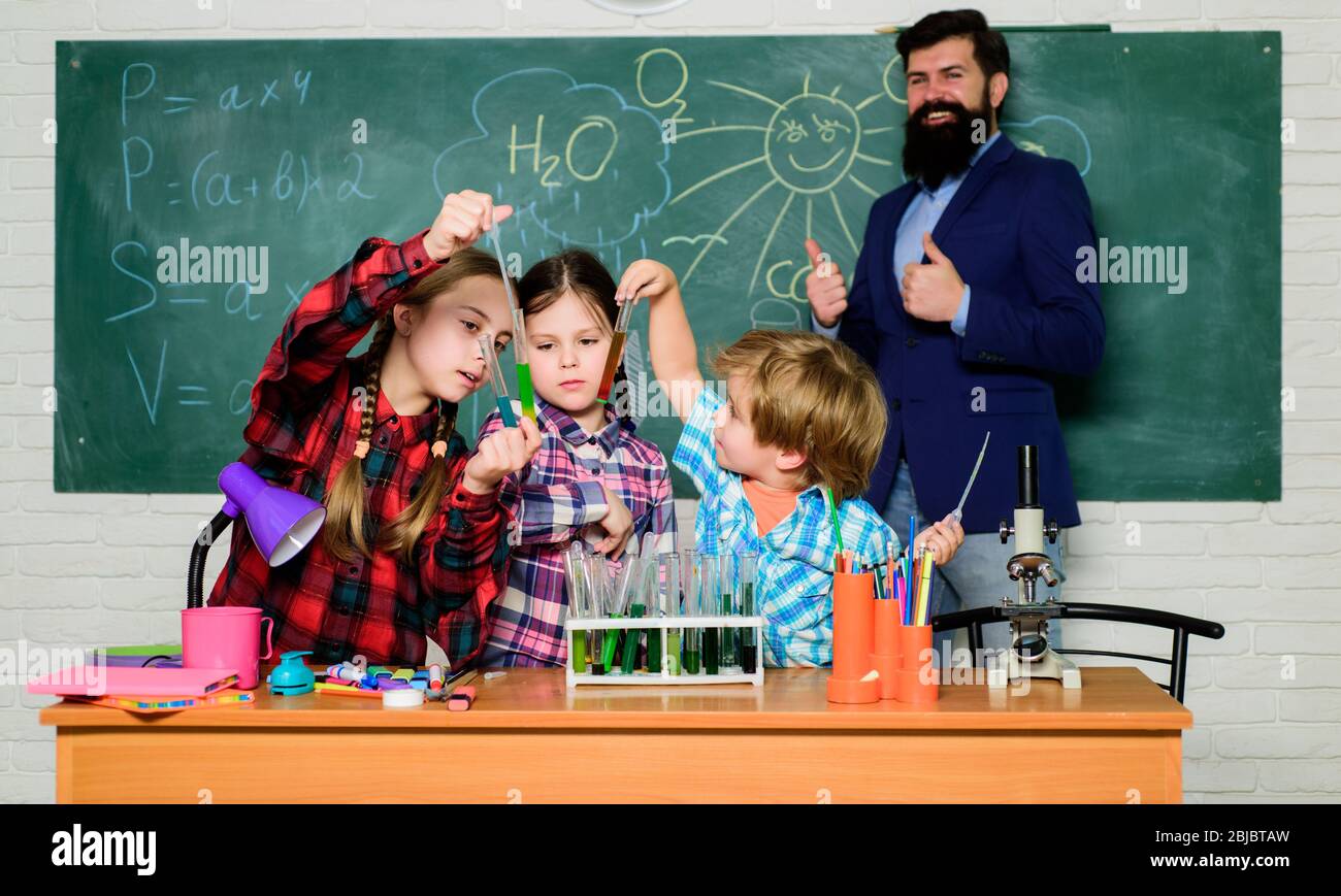 kids in lab coat learning chemistry in school laboratory. chemistry lab ...