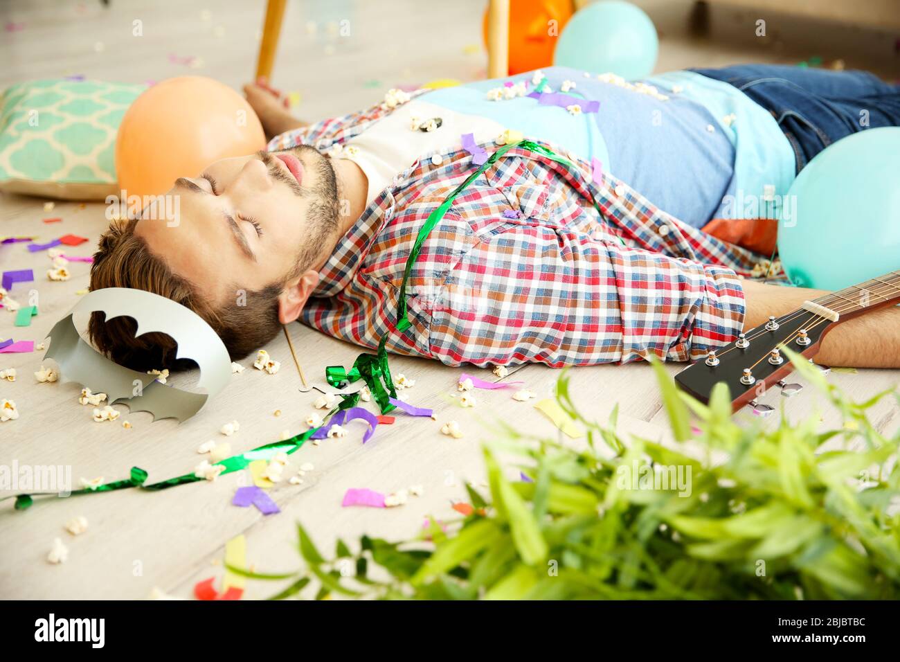 Tired drunk man after party at home Stock Photo - Alamy