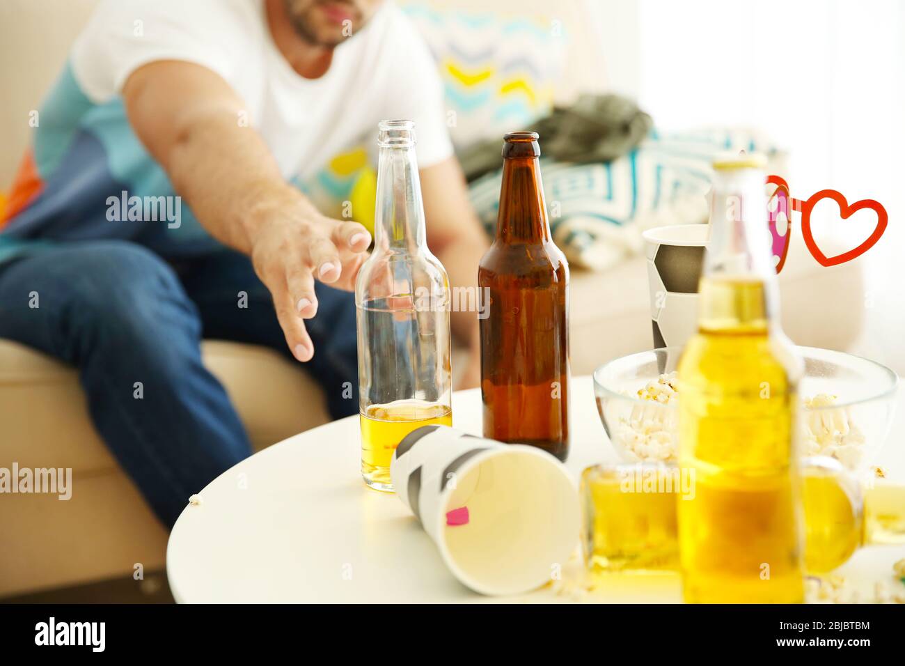 Tired drunk man after party at home Stock Photo - Alamy