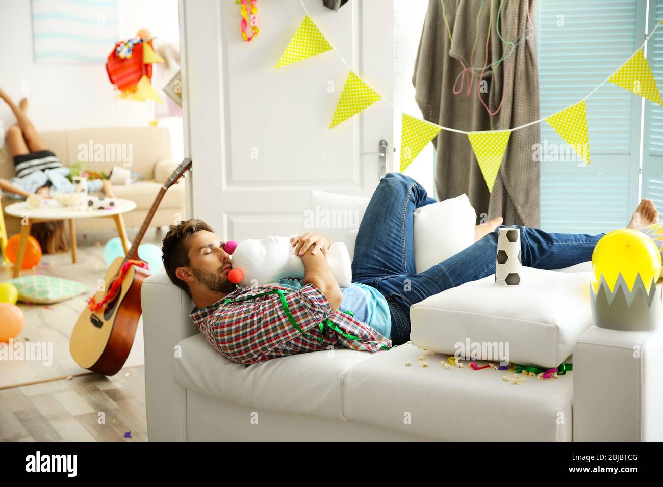 Tired drunk man after party at home Stock Photo - Alamy
