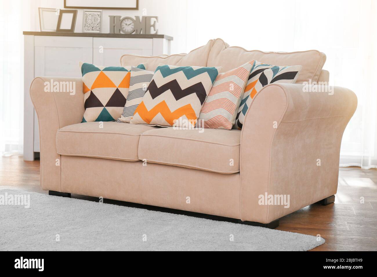 Modern home interior with couch Stock Photo - Alamy