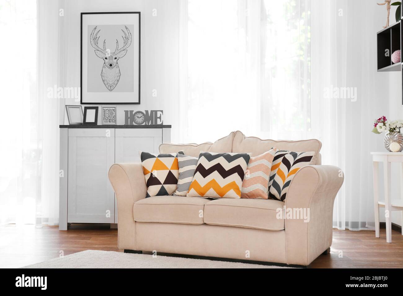 Modern home interior with couch Stock Photo - Alamy