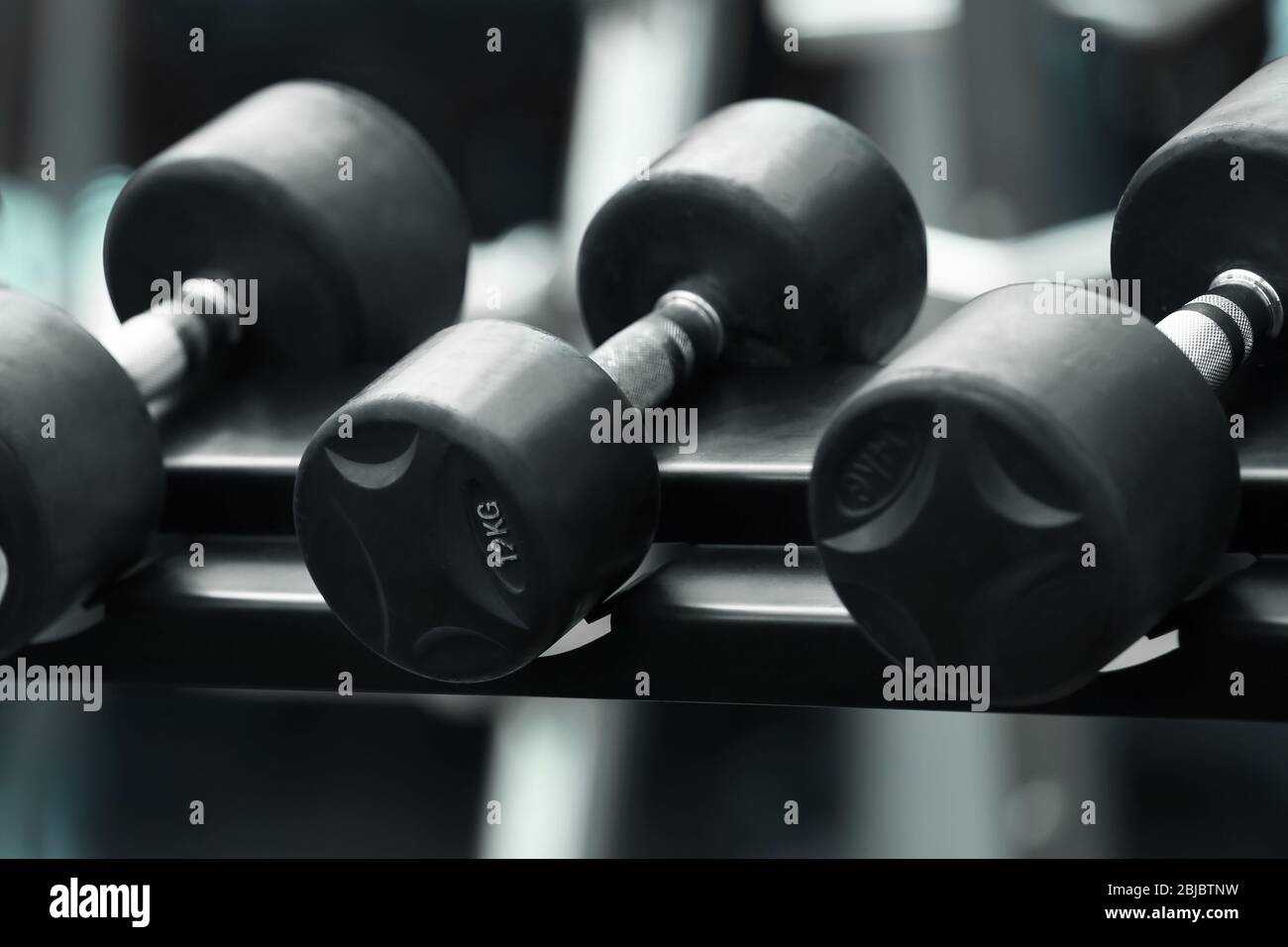 Set of dumbbells in gym Stock Photo - Alamy