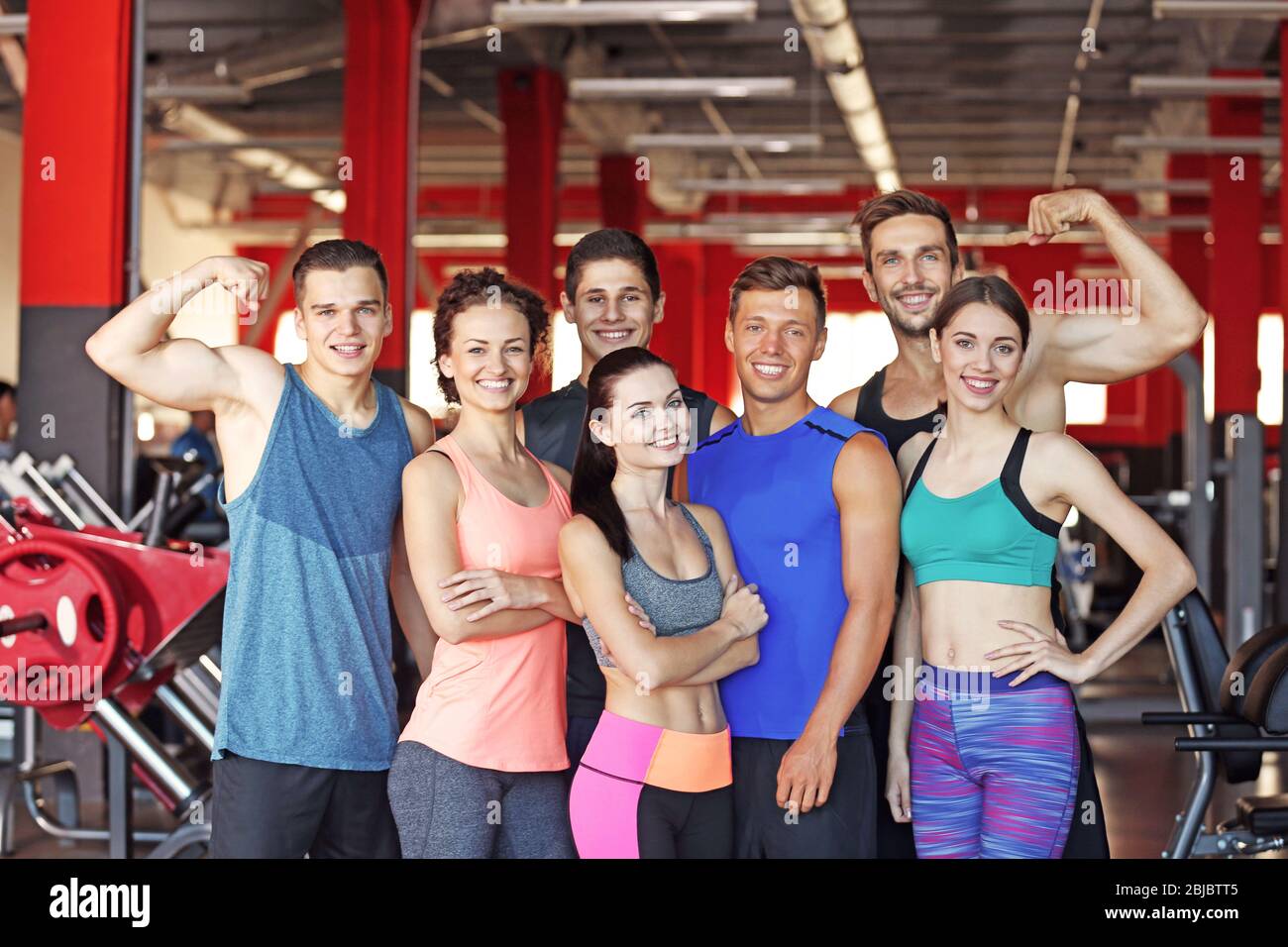 Group of sportive people in gym Stock Photo - Alamy