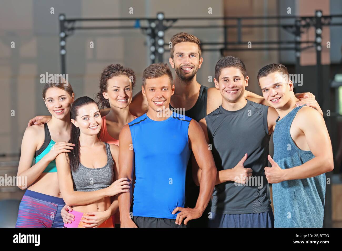 Group of sportive people in gym Stock Photo - Alamy