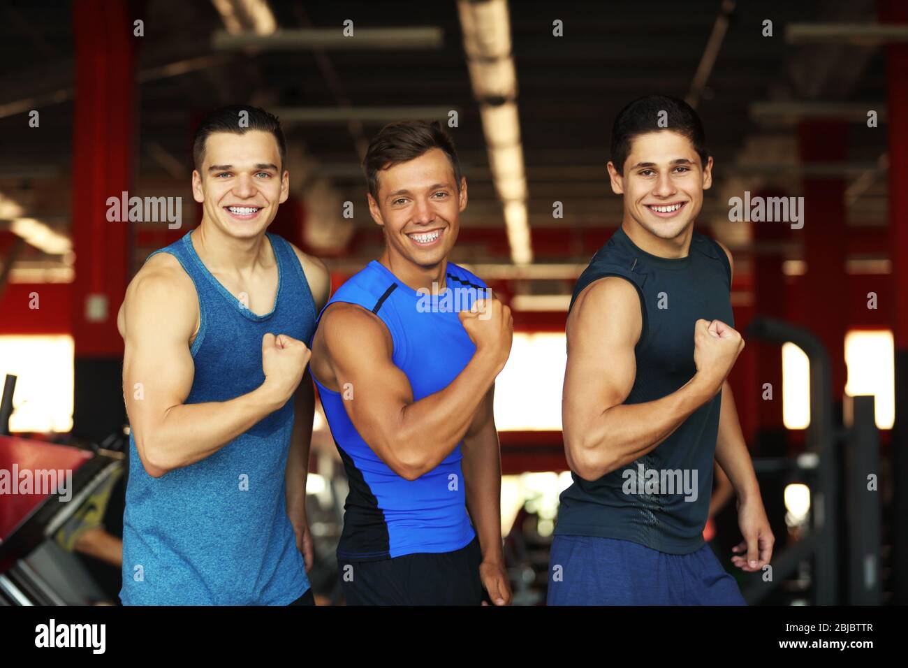 Portrait of athletic men in gym Stock Photo - Alamy