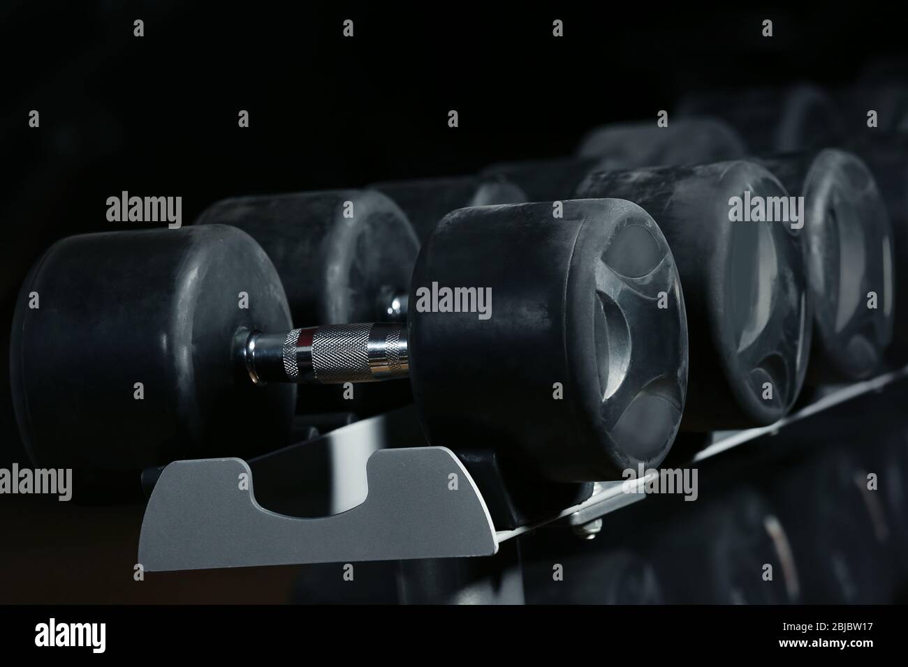 Set of dumbbells in gym Stock Photo - Alamy