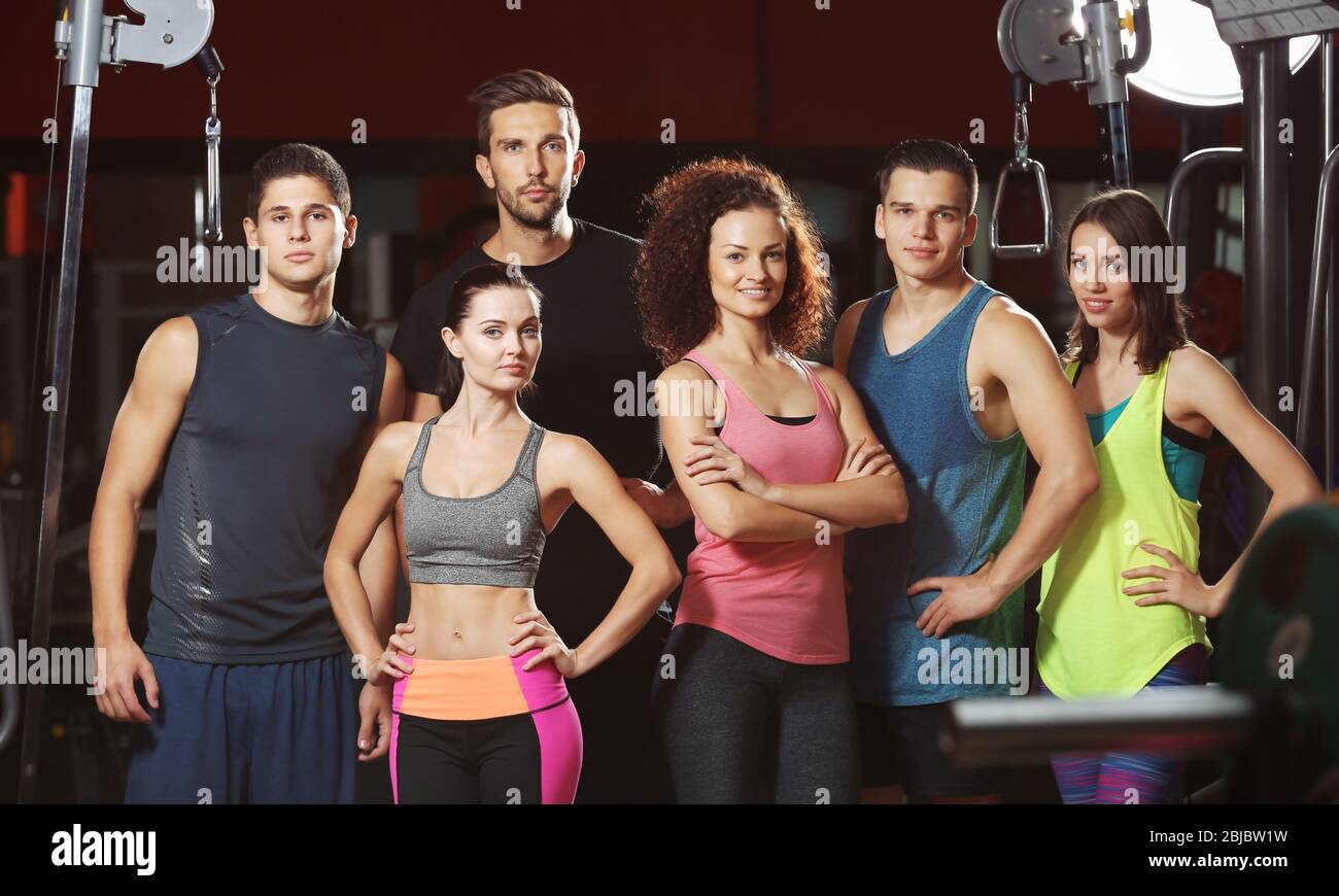 Group of sportive people in gym Stock Photo - Alamy