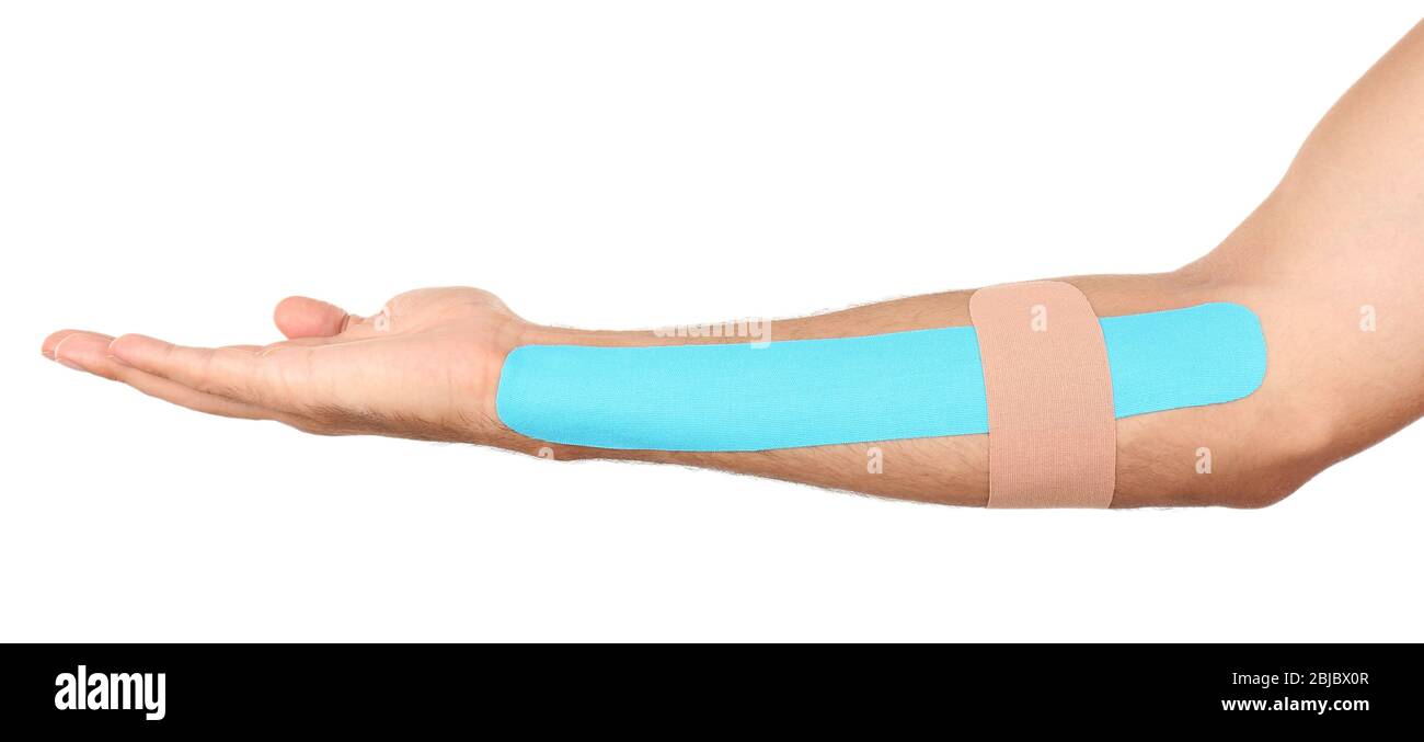 Physio tape on male arm isolated on white Stock Photo - Alamy