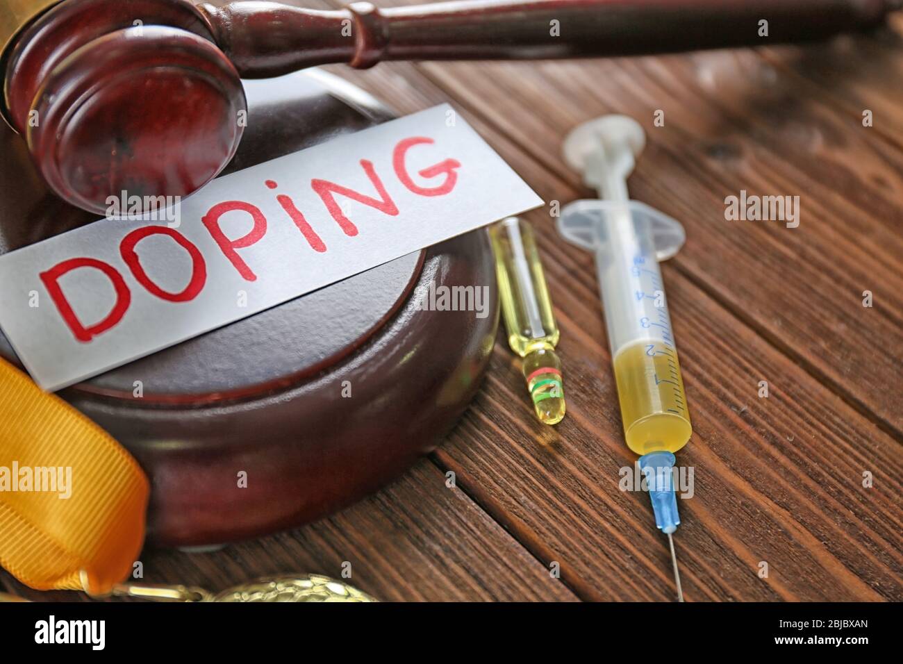 Gavel, word Doping and syringe on wooden background Stock Photo - Alamy