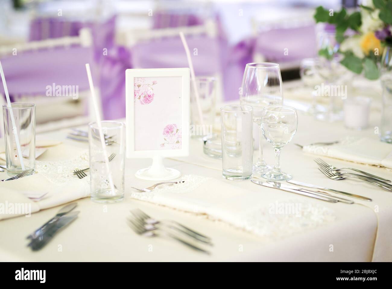 Wedding table set up and a blank table sign Stock Photo - Alamy