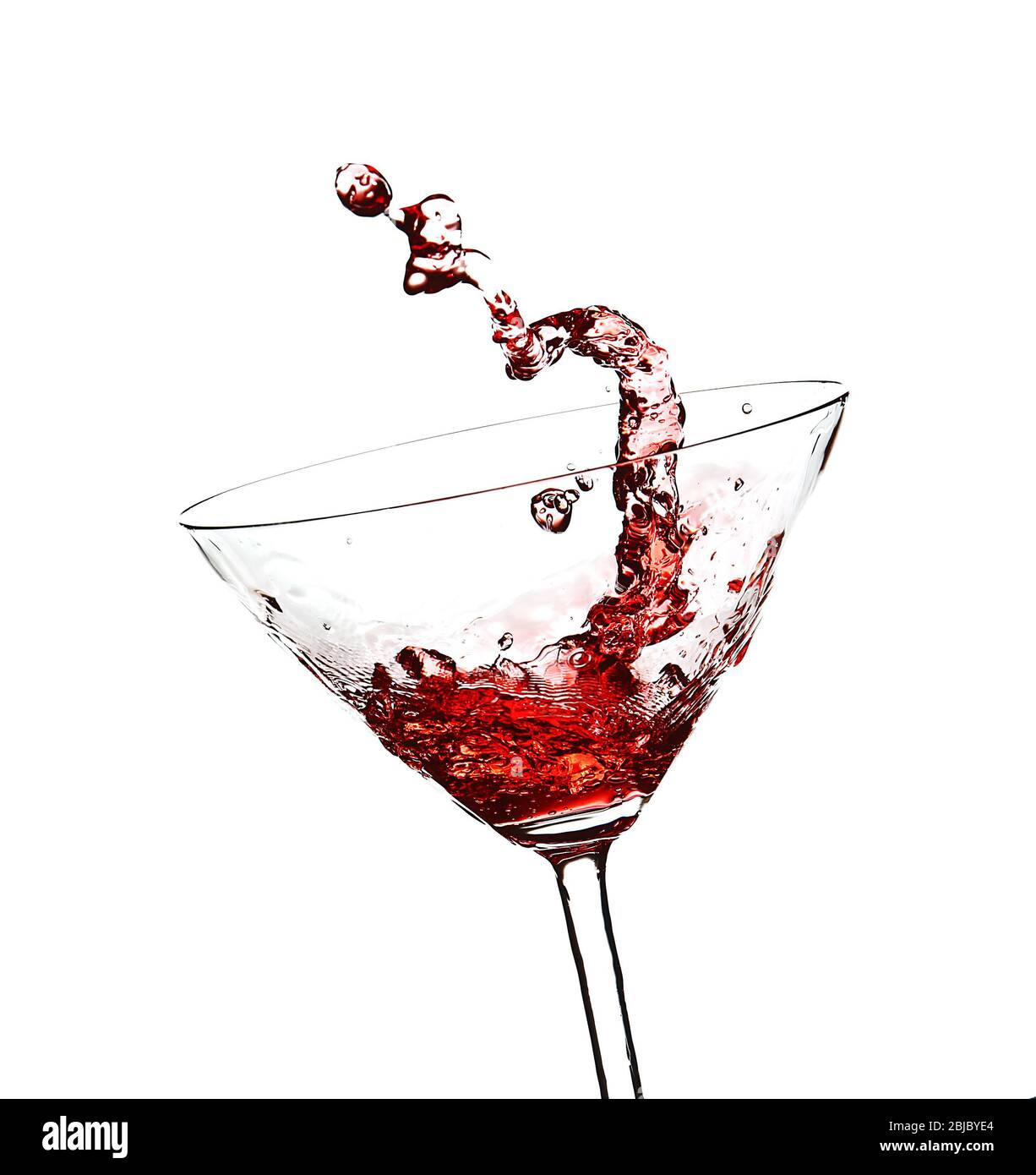 Red cocktail with splash on white background Stock Photo - Alamy