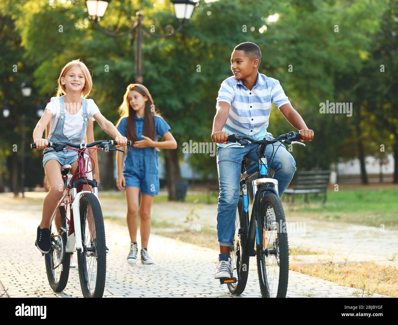 Children riding bicycles african hi-res stock photography and images ...