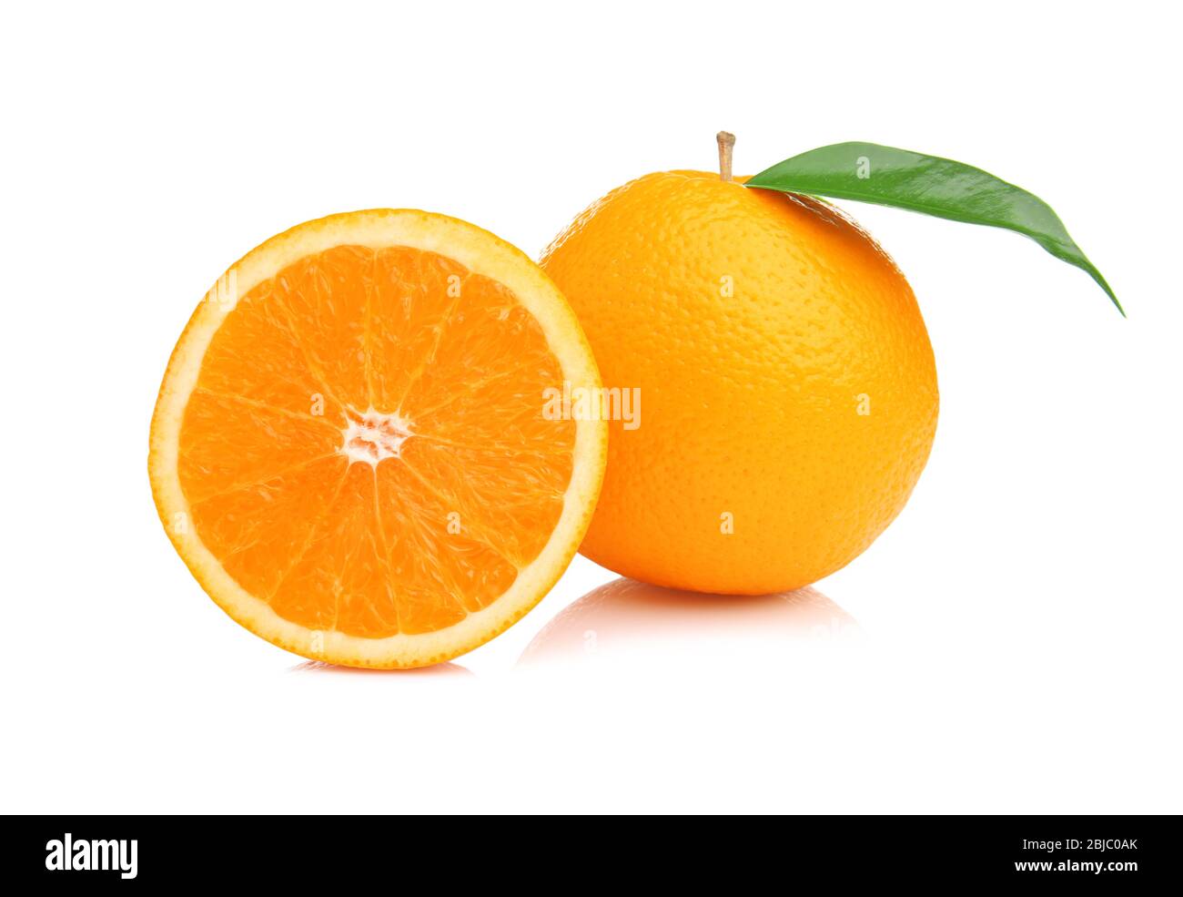 Ripe cutting orange with green leaf isolated on white Stock Photo - Alamy