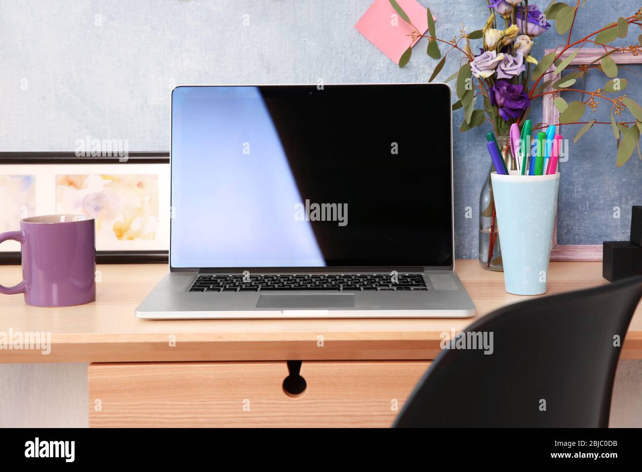 Modern workplace with laptop at home Stock Photo - Alamy