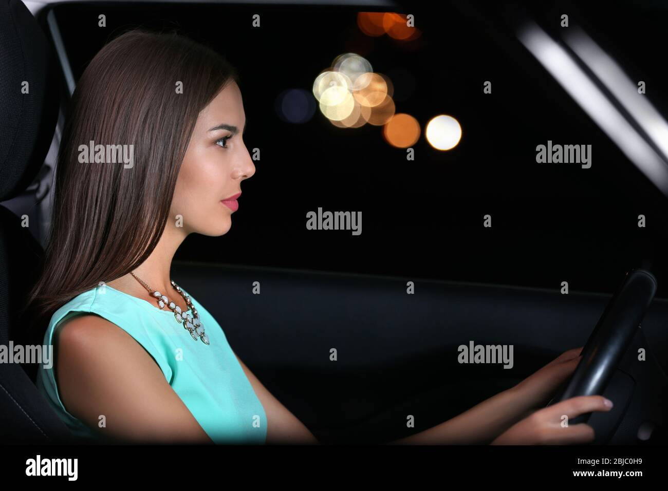 Beautiful girl driving a car Stock Photo - Alamy