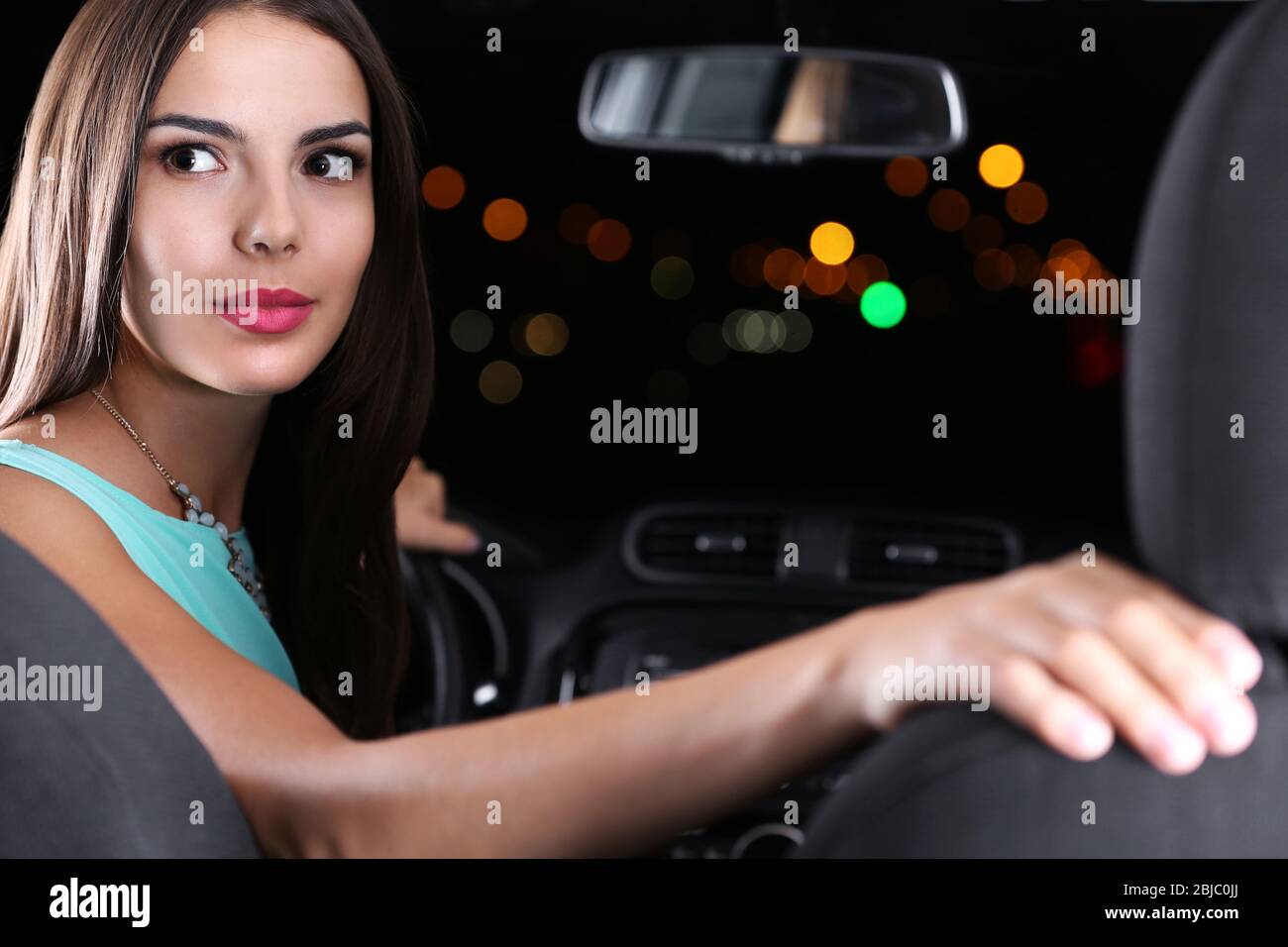 Beautiful girl driving a car Stock Photo - Alamy