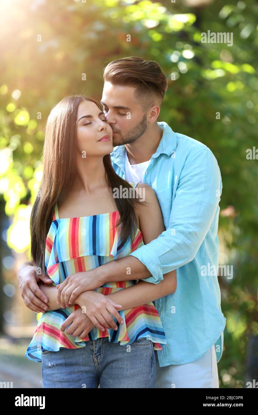 Lovely couple hugging on street Stock Photo - Alamy