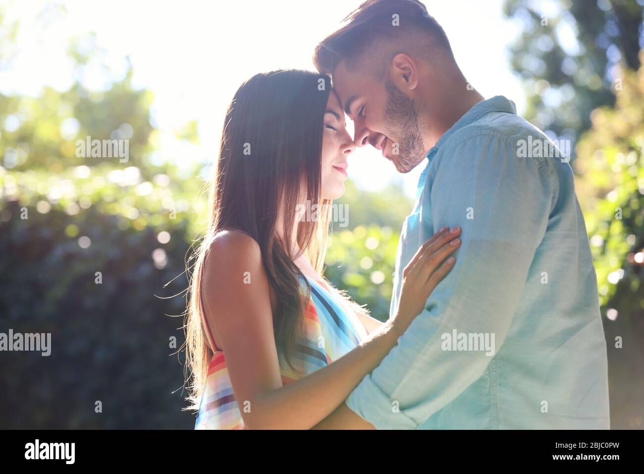 Lovely couple hugging on street Stock Photo - Alamy
