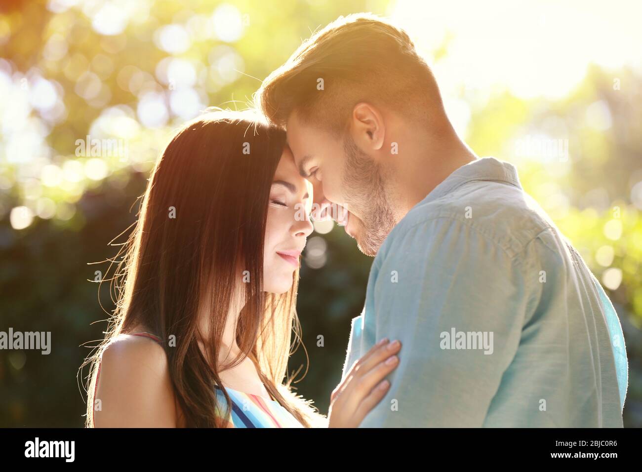 Lovely couple hugging on street Stock Photo - Alamy