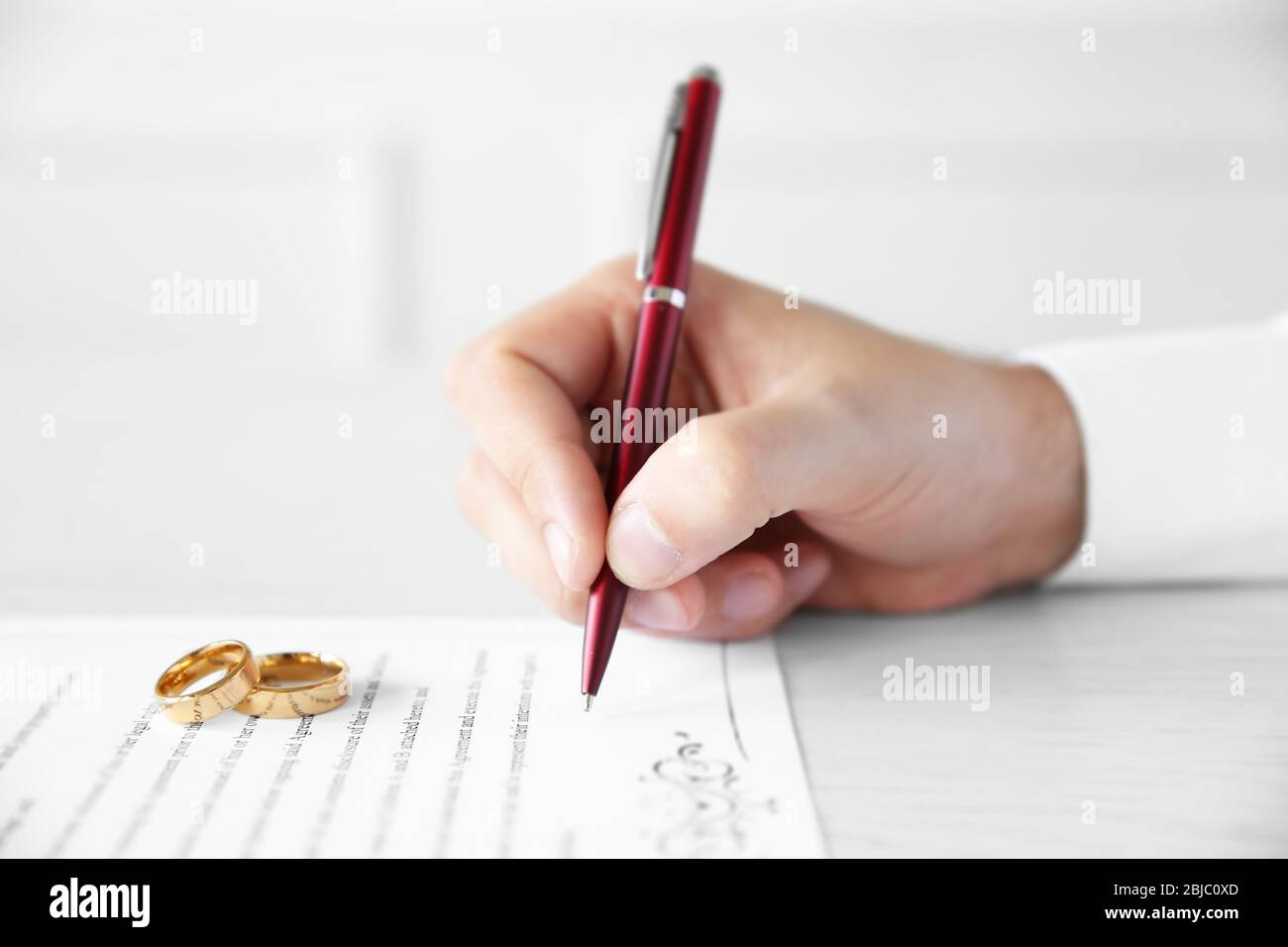 Man signing marriage contract, closeup Stock Photo - Alamy