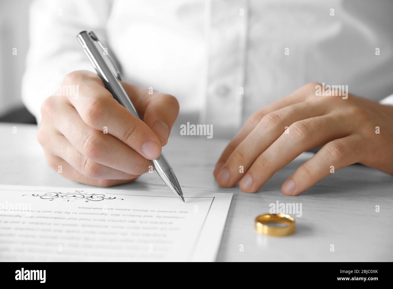 Man signing marriage contract, closeup Stock Photo - Alamy