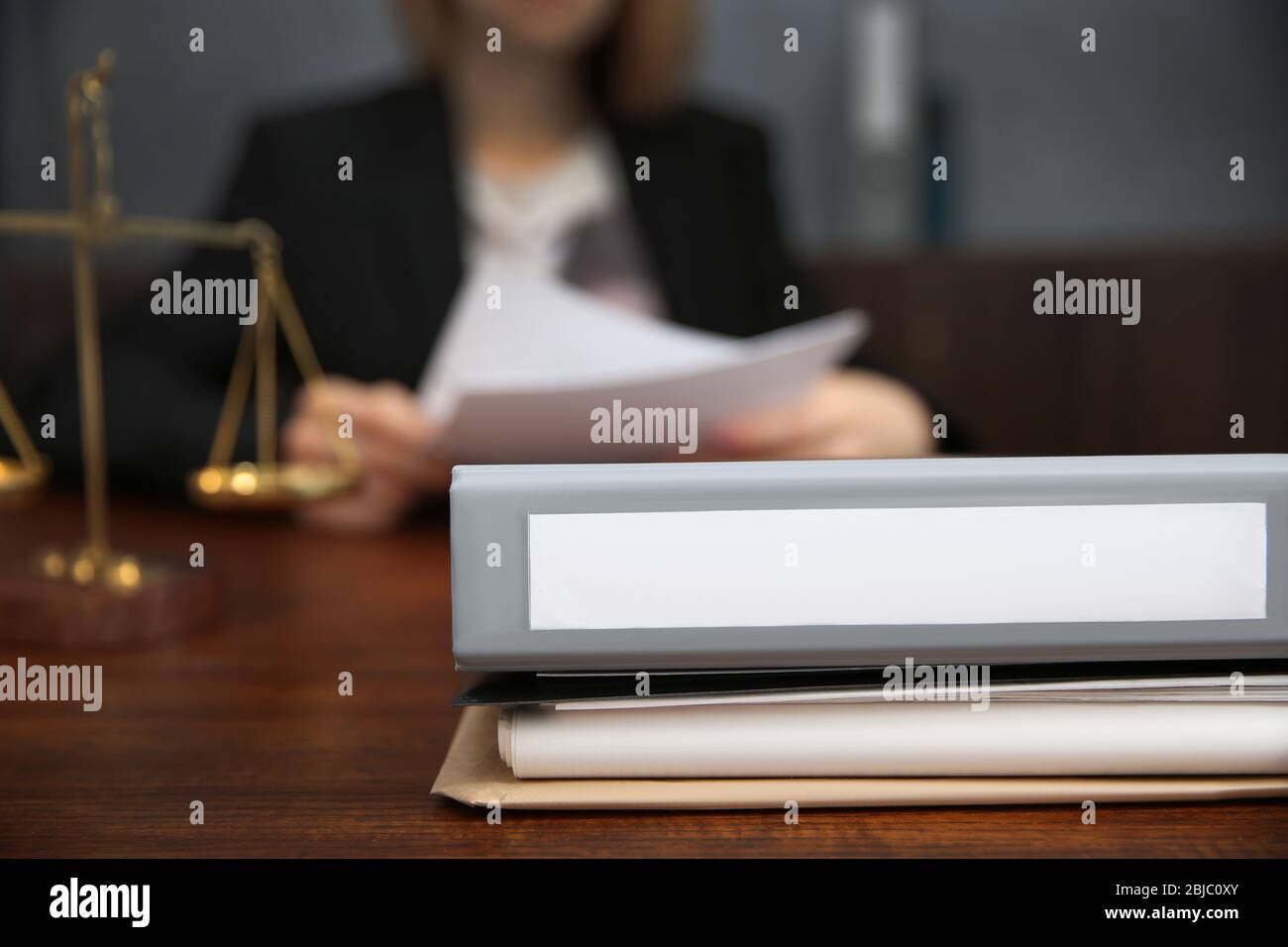 Folder on lawyer table, closeup Stock Photo - Alamy