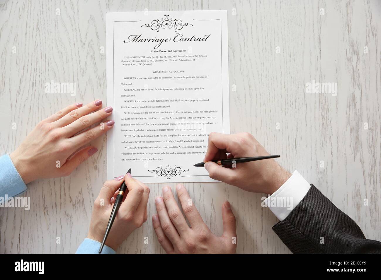 Bride groom signing marriage certificate hi-res stock photography and ...
