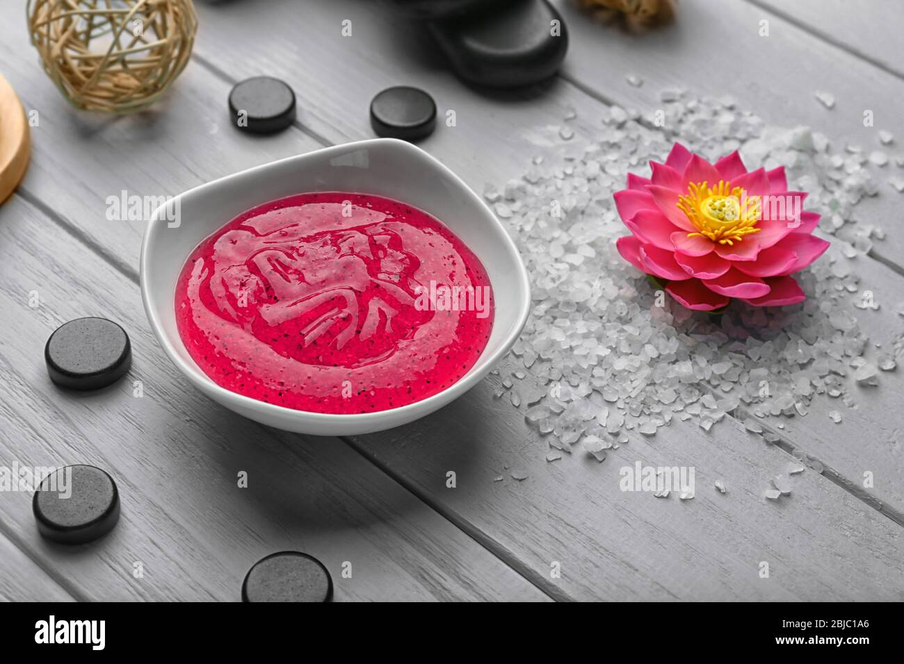 Still life with body scrub on wooden background Stock Photo - Alamy