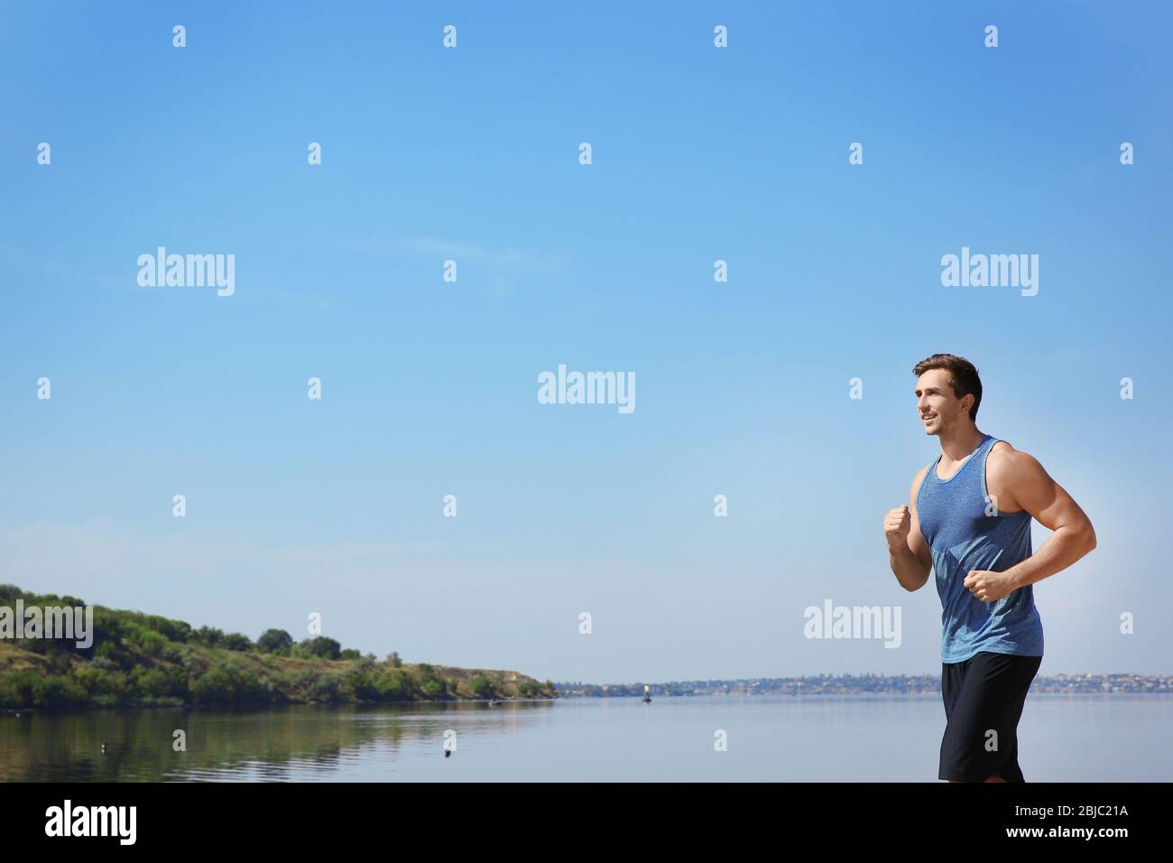 Man stretching by the riverside hi-res stock photography and images - Alamy