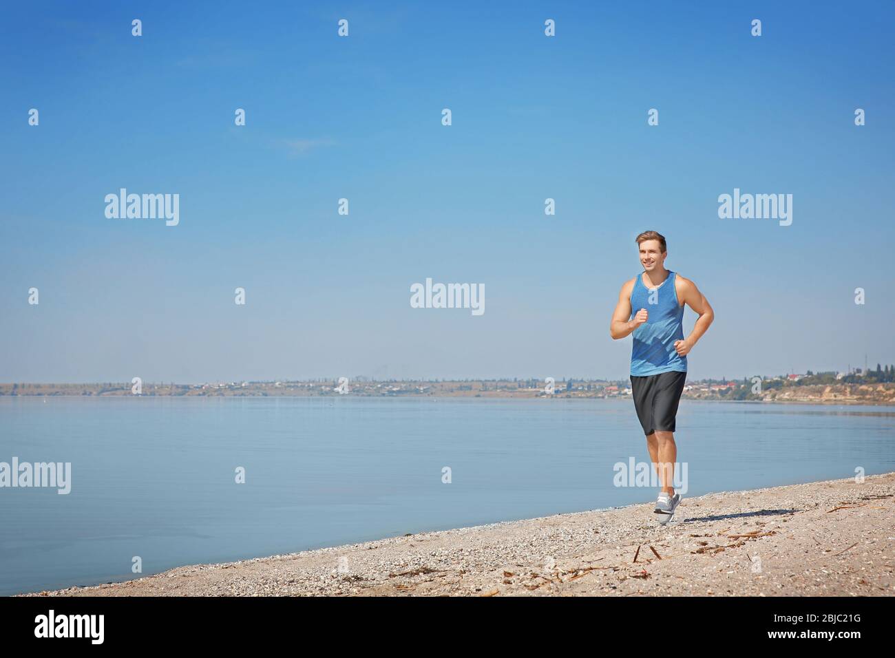 Man stretching by the riverside hi-res stock photography and images - Alamy
