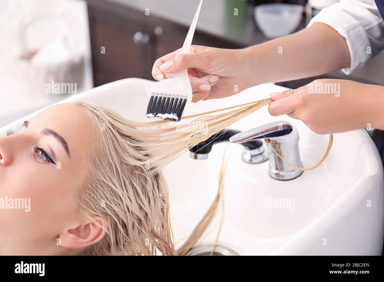 Hairdresser applying on wet hi-res stock photography and images - Alamy