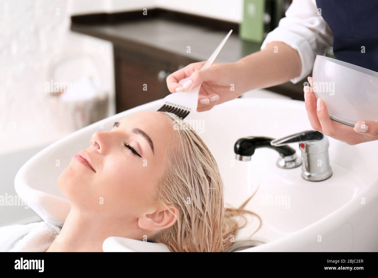 Hairdresser applying on wet hi-res stock photography and images - Alamy