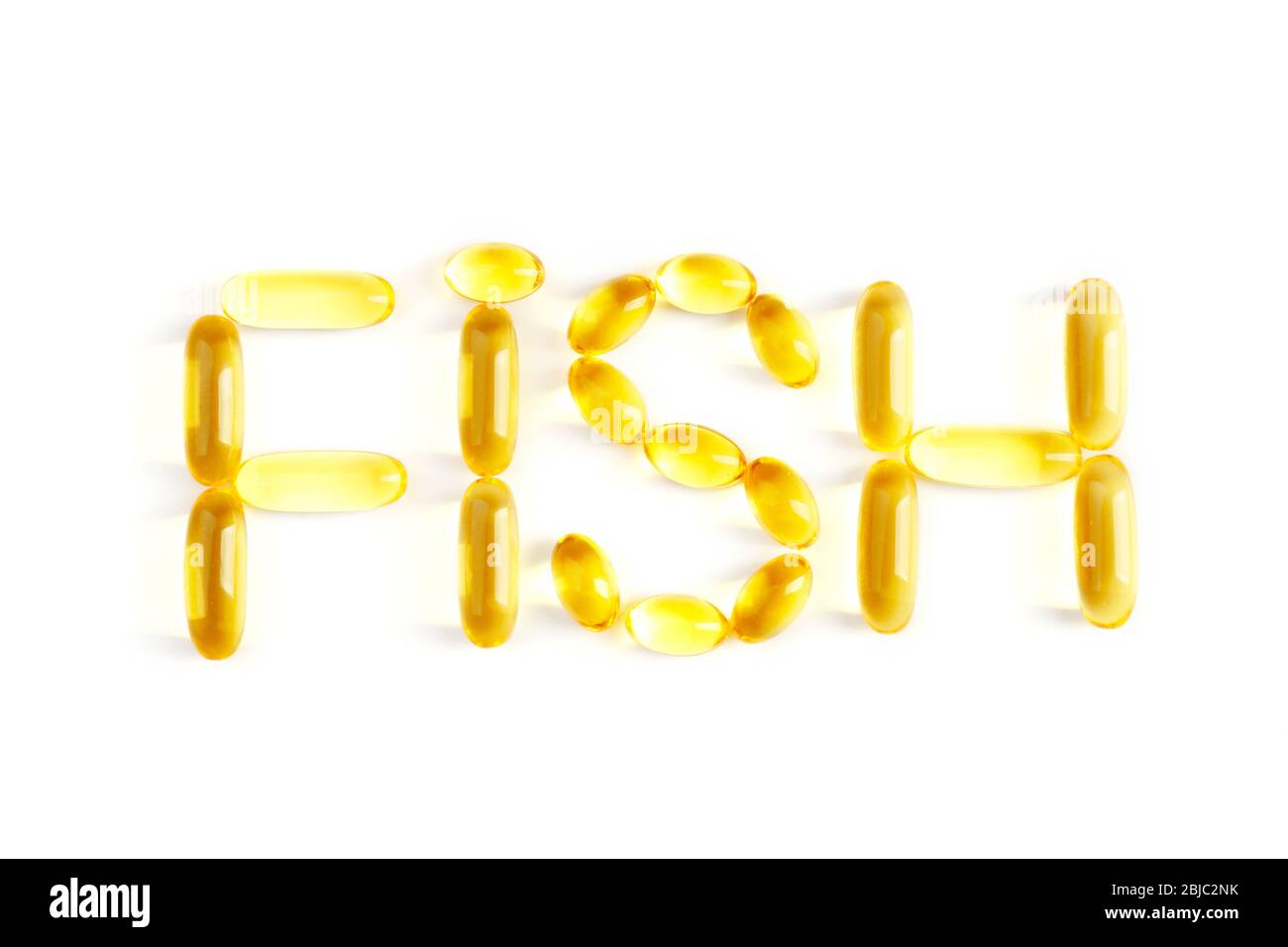 Word FISH made of cod liver oil capsules on white background Stock ...