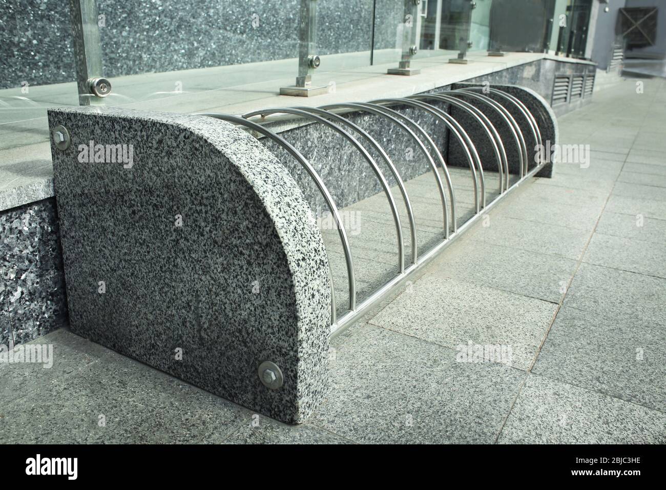 Metal public bike rack Stock Photo - Alamy